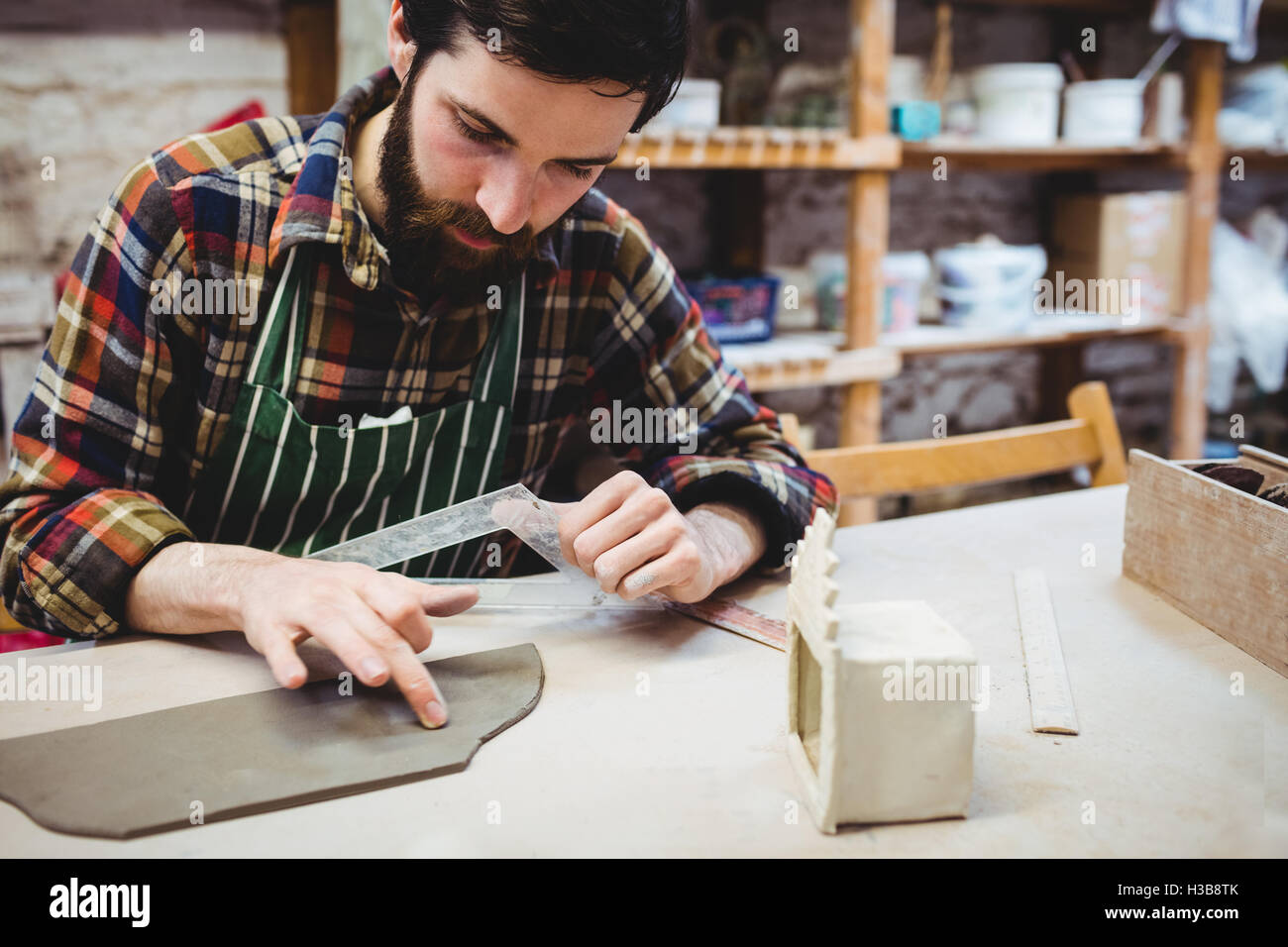 Man working at workshop Stock Photo - Alamy