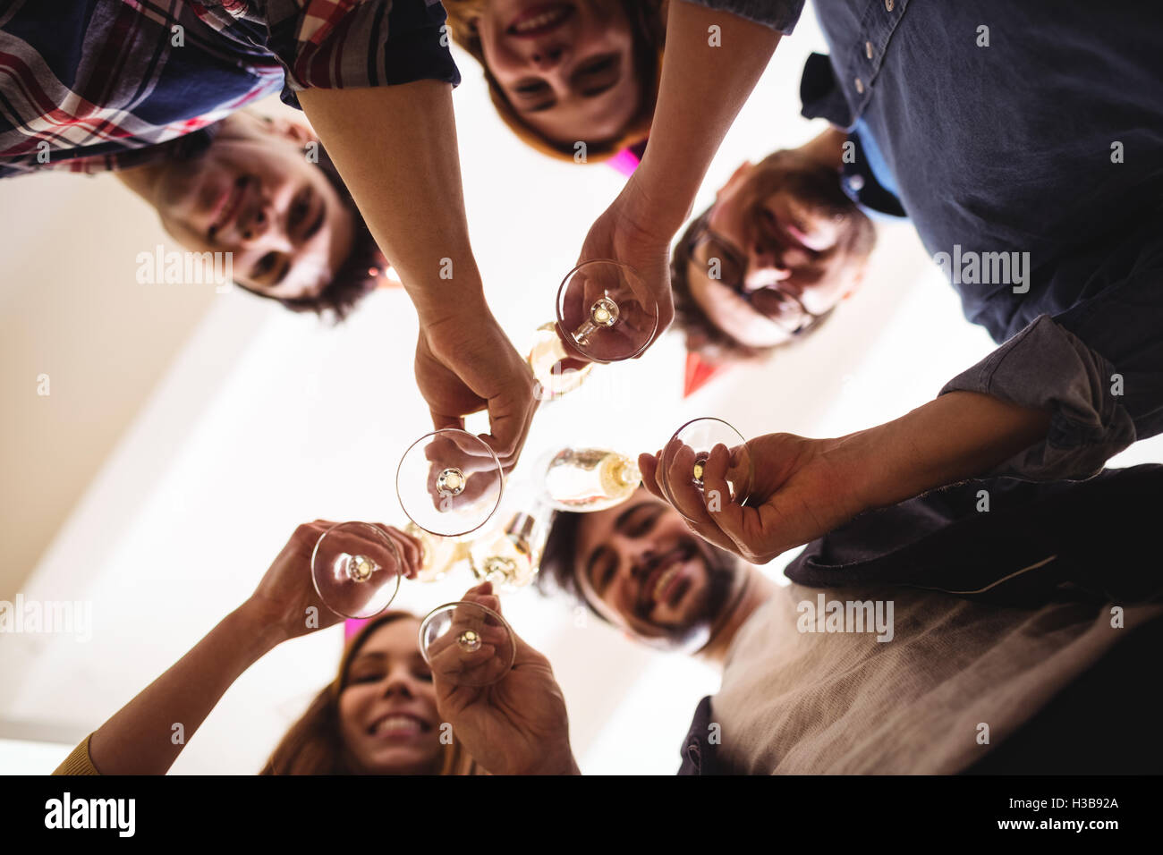Smiling business people toasting drink at birthday party Stock Photo ...