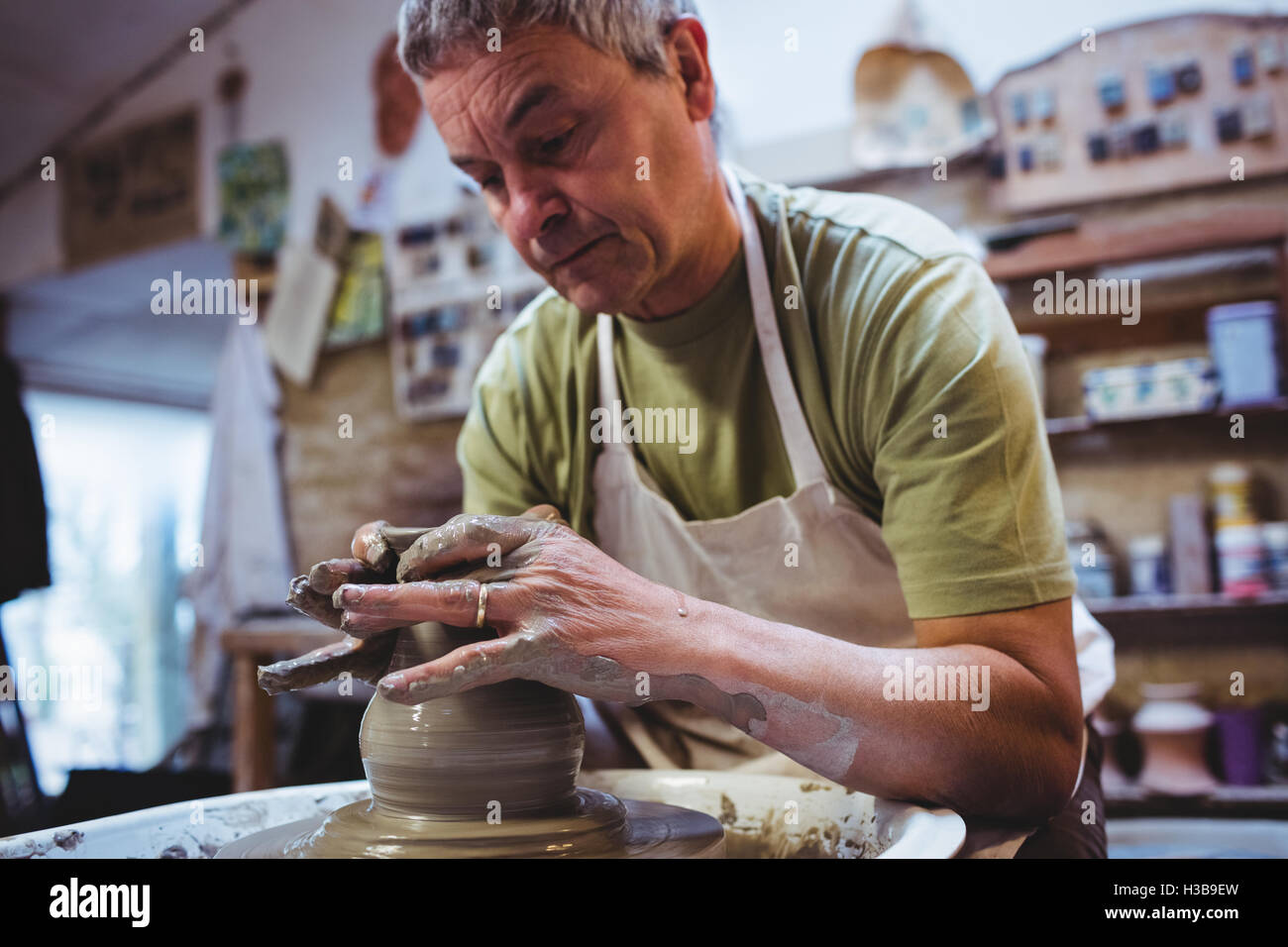 Potter molding shape at workshop Stock Photo - Alamy