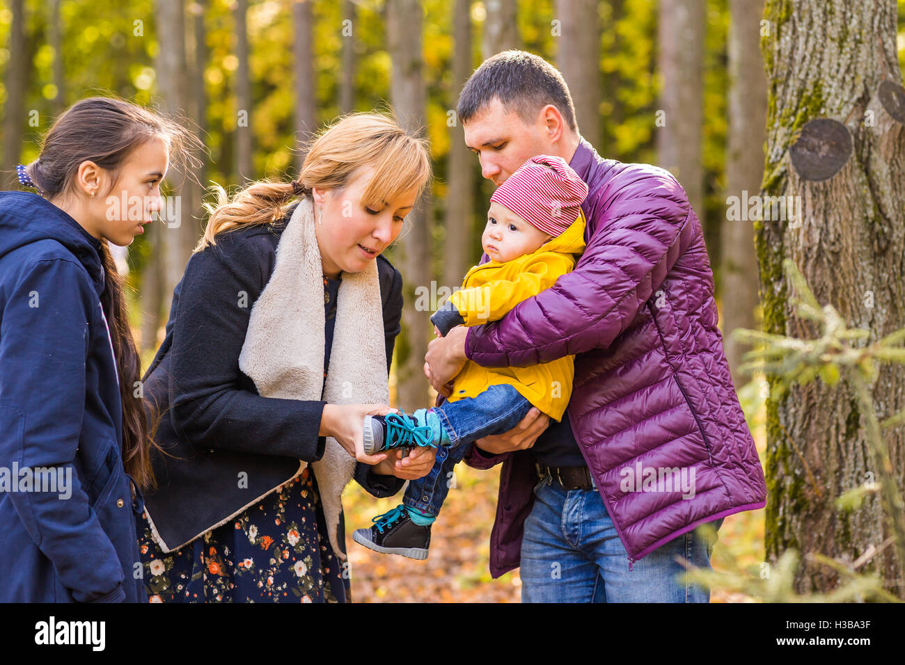 friendly family in the park in autumn together Stock Photo - Alamy