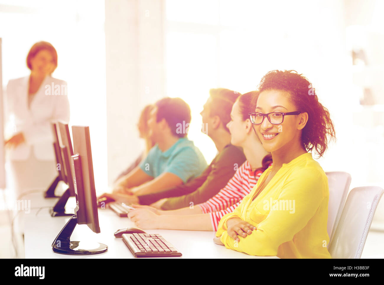 female student with classmates in computer class Stock Photo - Alamy