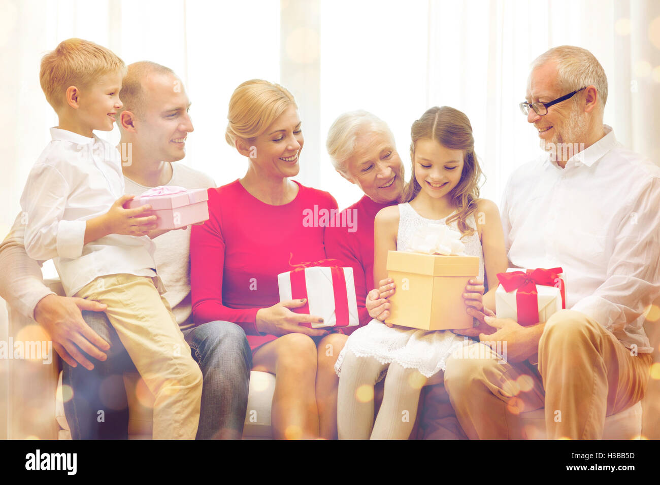 smiling family with gifts at home Stock Photo - Alamy