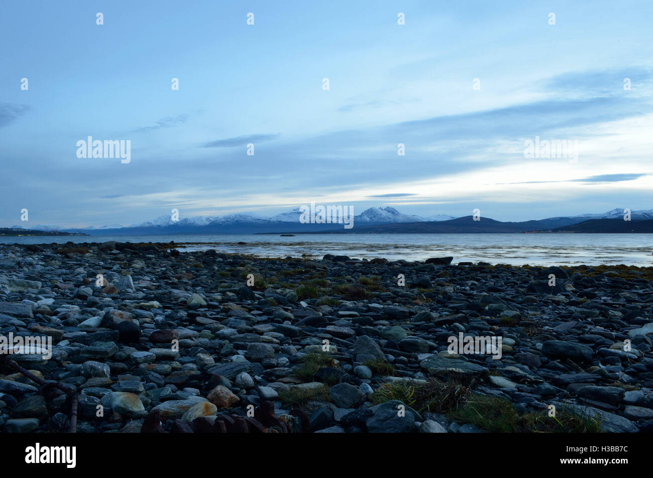 beautiful blue fjord with new snow on mountain background Stock Photo ...