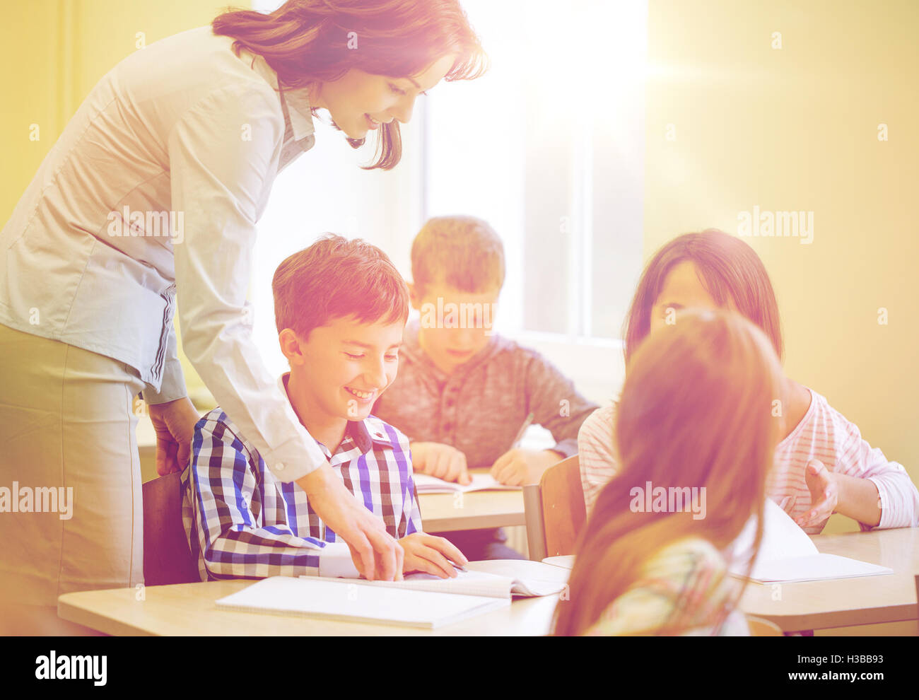 group of school kids writing test in classroom Stock Photo - Alamy