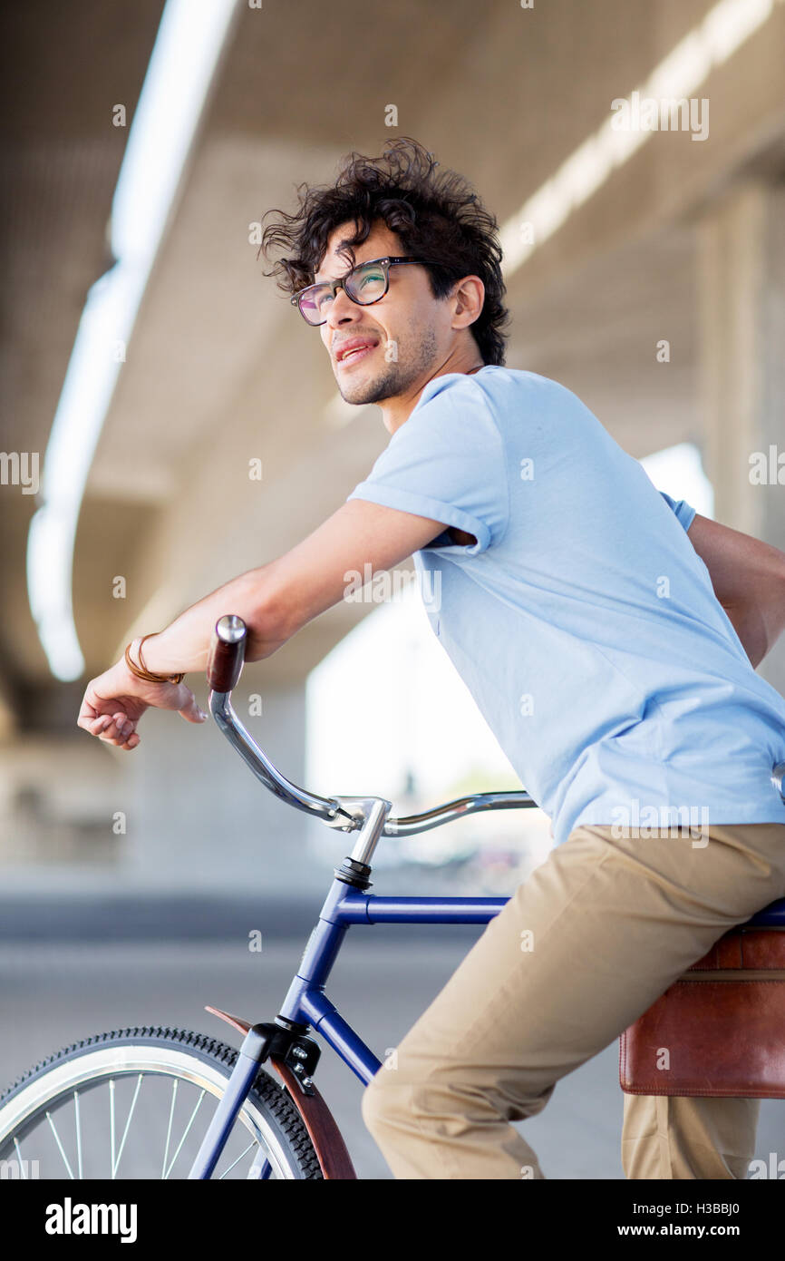 young hipster man riding fixed gear bike Stock Photo - Alamy