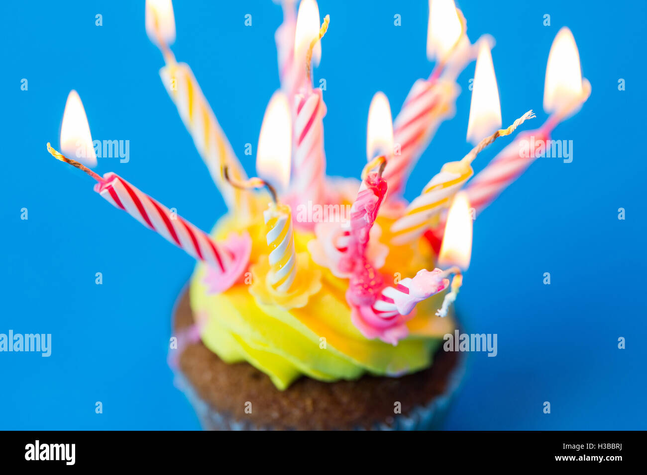 birthday cupcake with many burning candles Stock Photo - Alamy