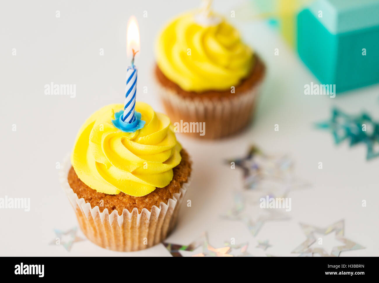 birthday cupcakes with burning candles Stock Photo - Alamy