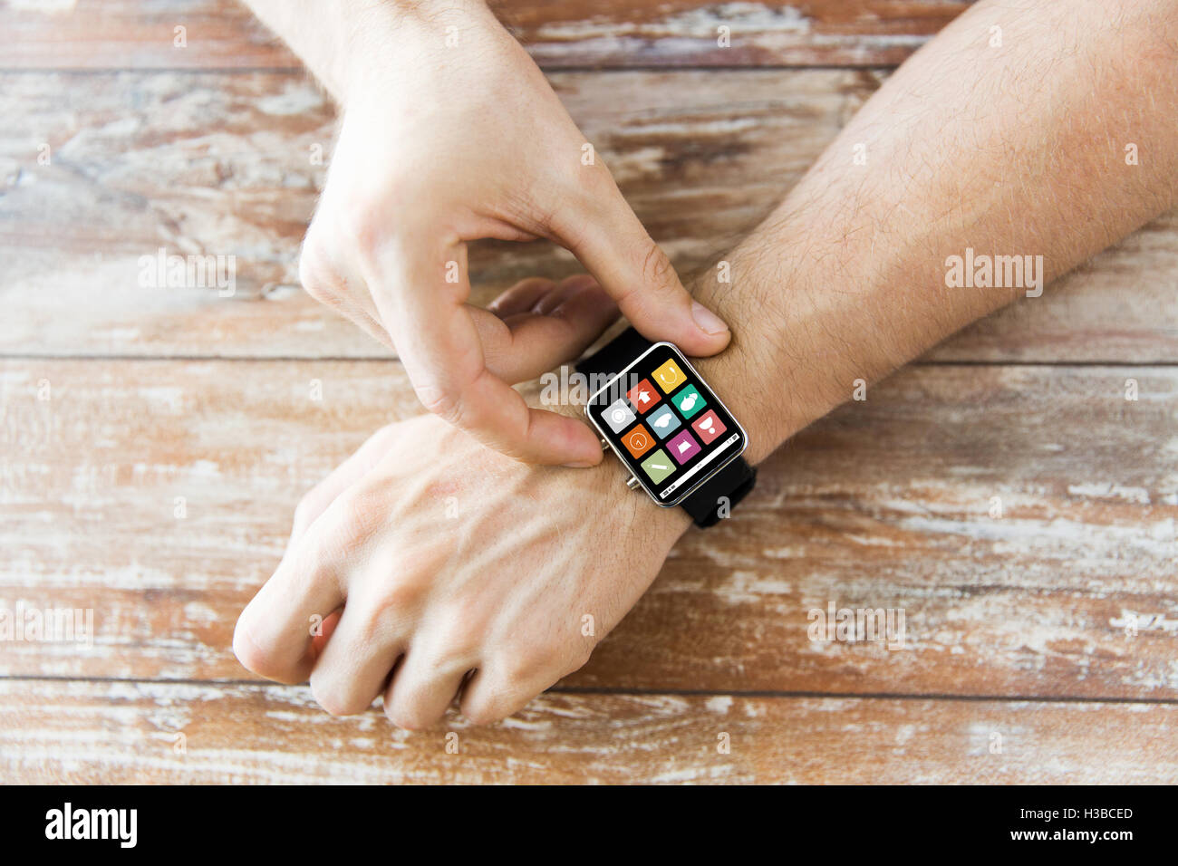 close up of hands setting smart watch with icons Stock Photo - Alamy