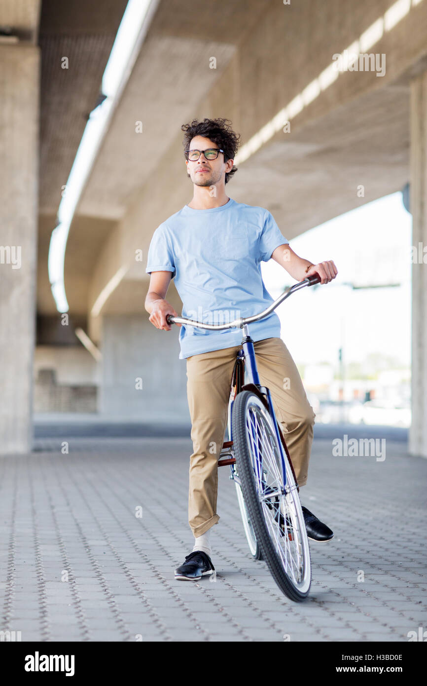 young hipster man riding fixed gear bike Stock Photo - Alamy