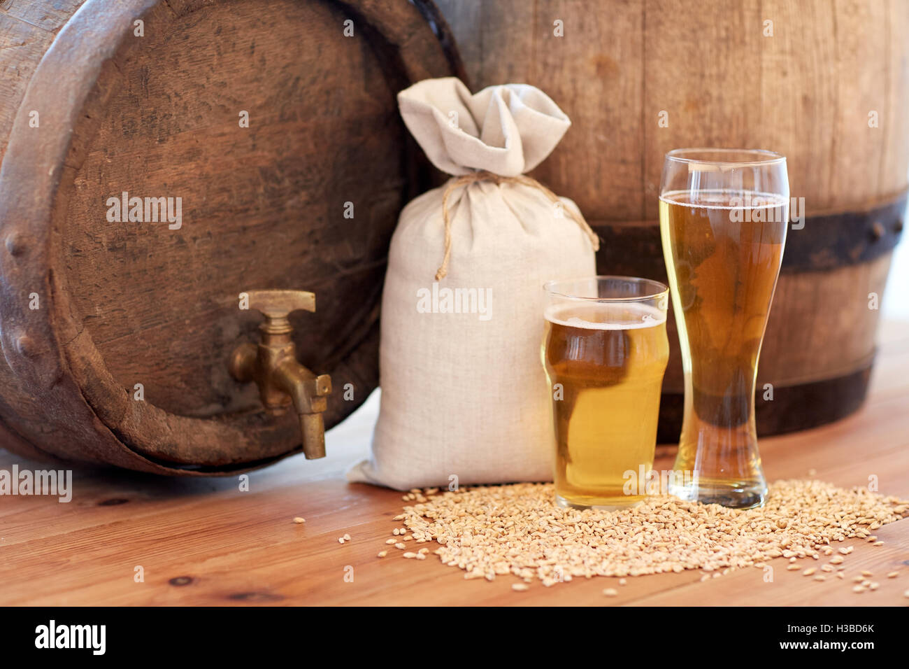 close up of beer barrel, glasses and bag with malt Stock Photo - Alamy