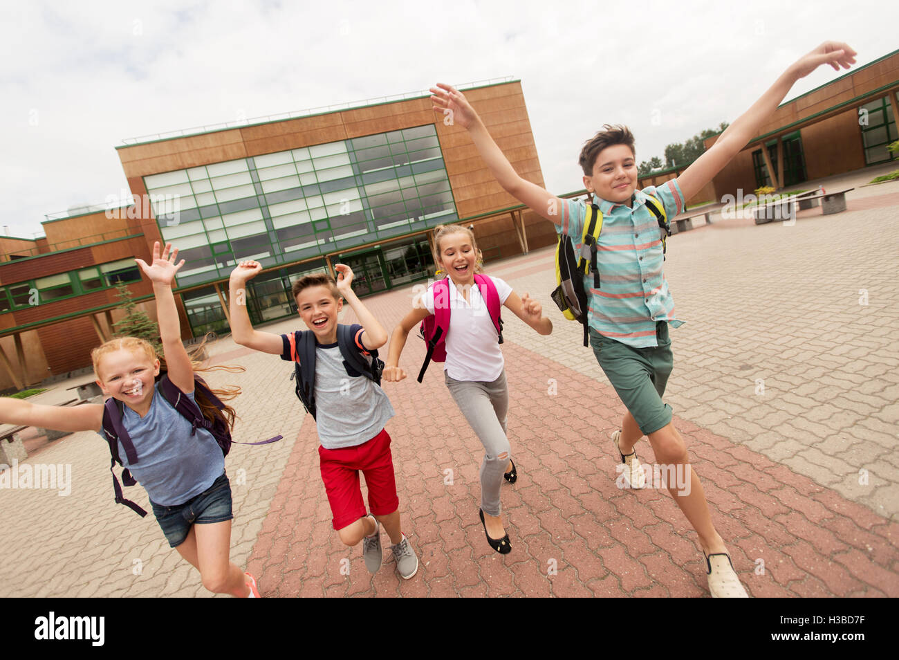 group of happy elementary school students running Stock Photo - Alamy
