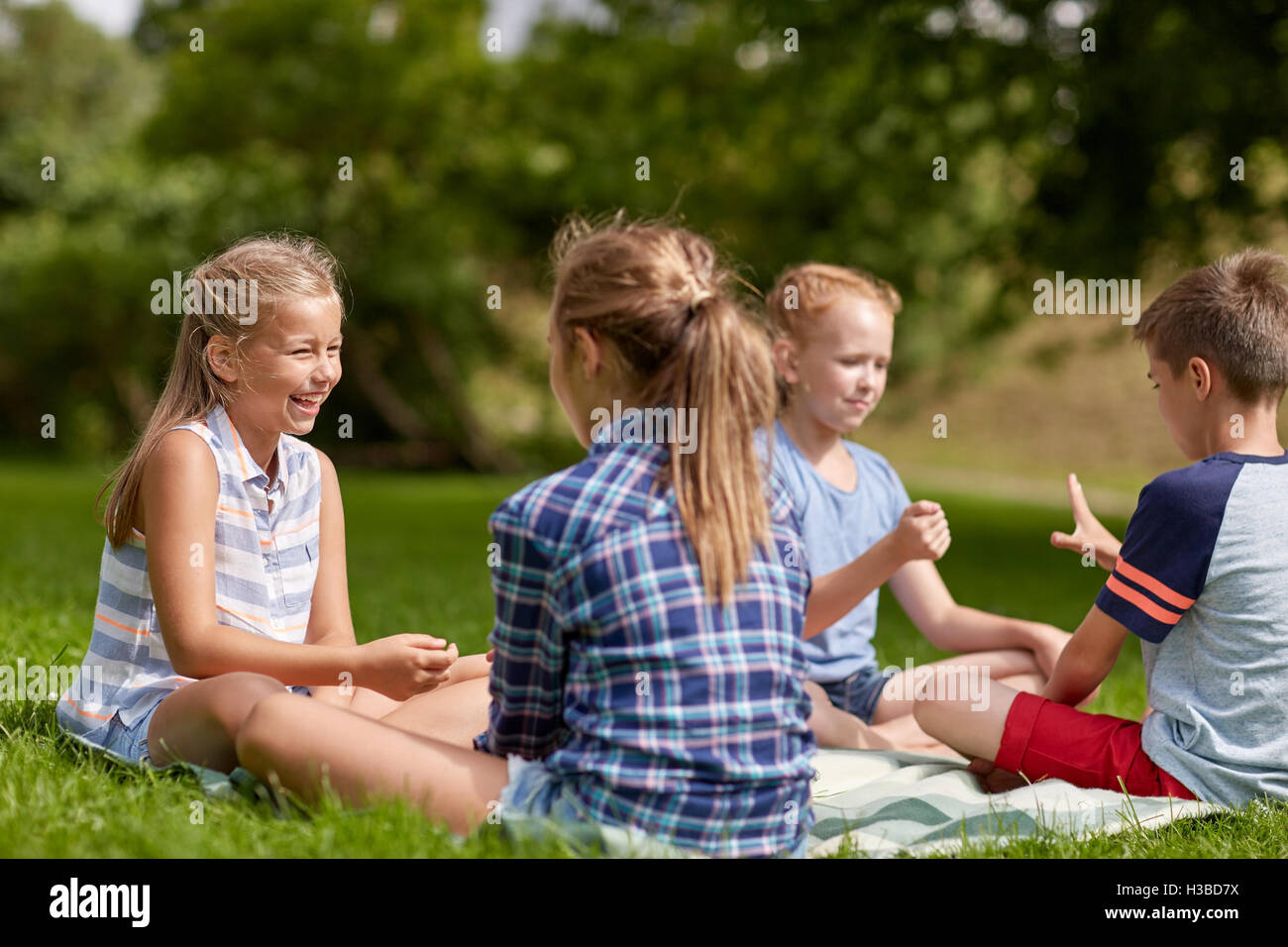 happy kids playing rock-paper-scissors game Stock Photo - Alamy