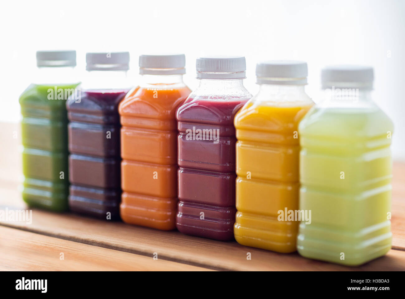 bottles with different fruit or vegetable juices Stock Photo - Alamy