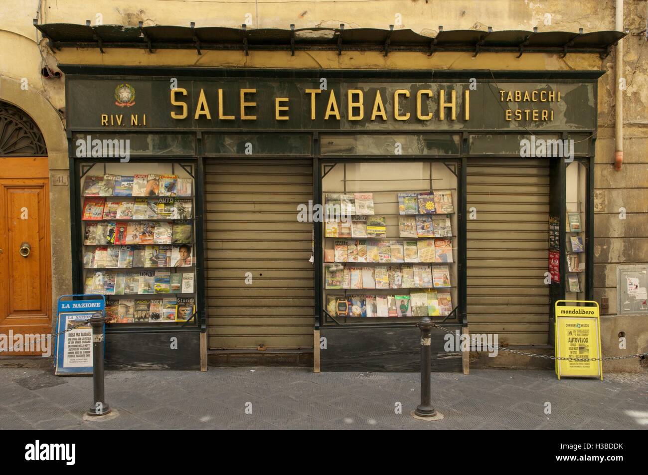 Old fashioned tobacconist shop with magazines in Arezzo, Italy Stock ...