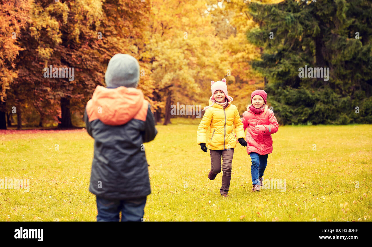 group of happy little kids running outdoors Stock Photo - Alamy