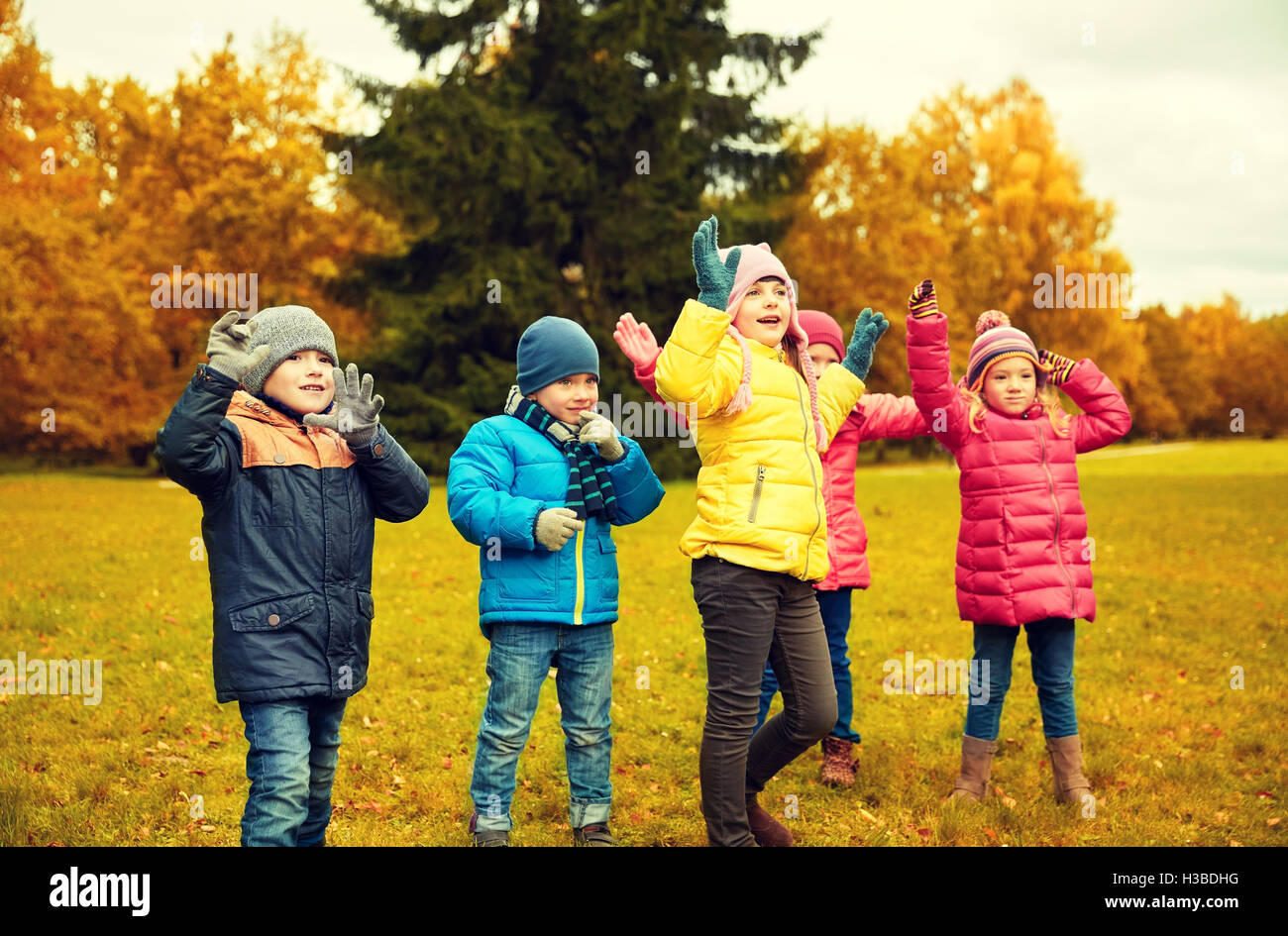 group of happy children having fun in autumn park Stock Photo - Alamy