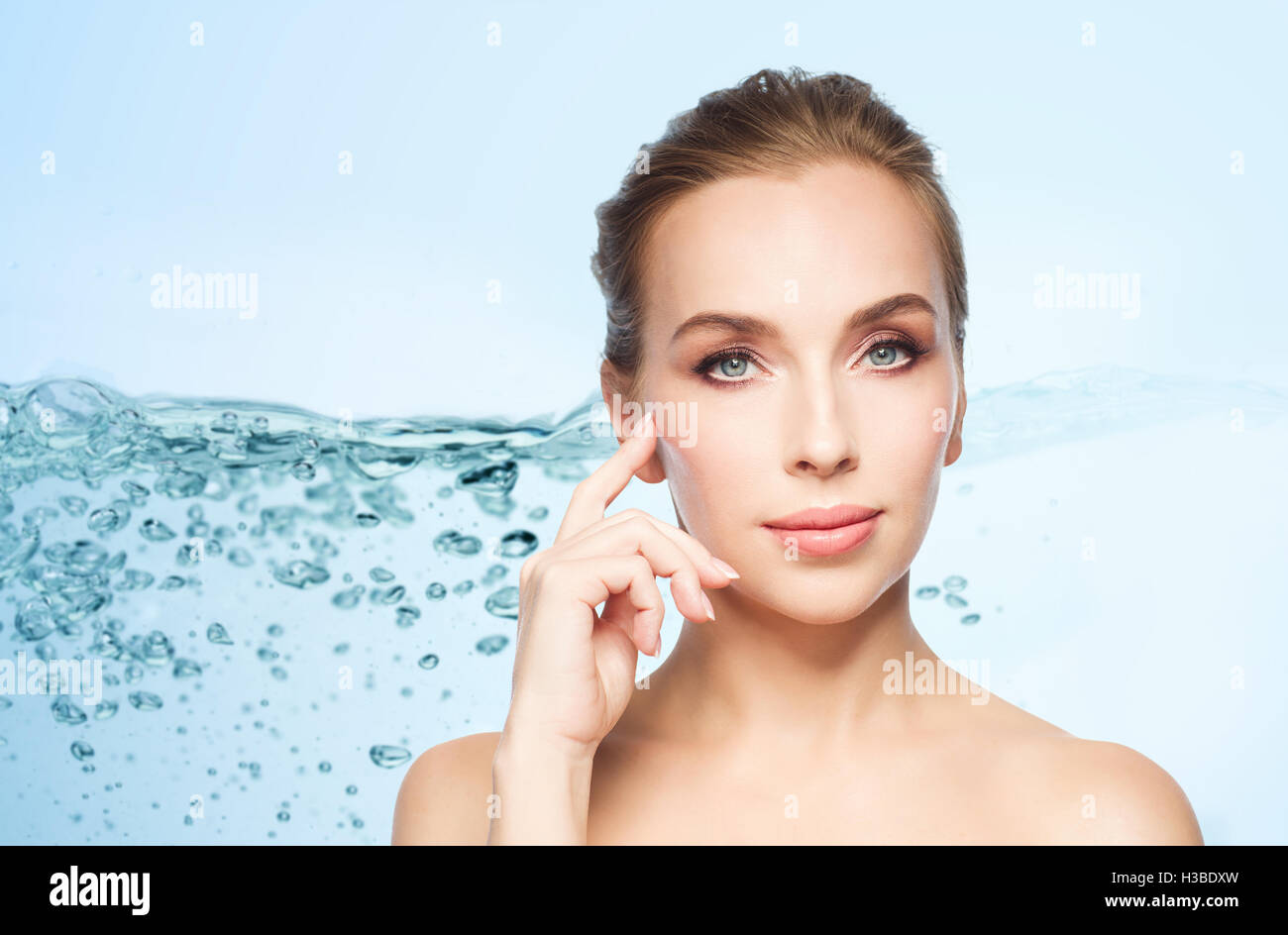beautiful young woman showing her cheekbone Stock Photo - Alamy