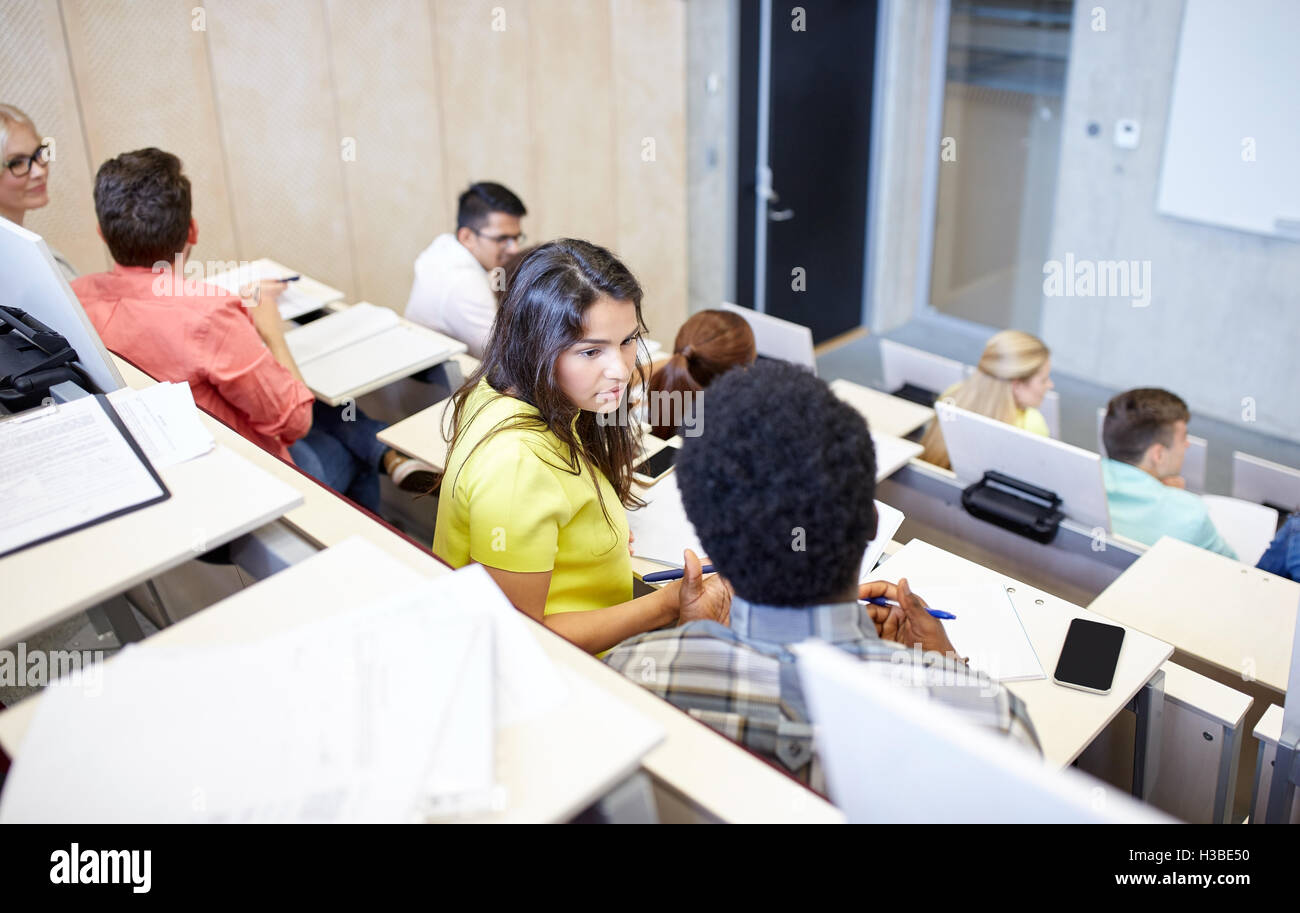 group of students with notebooks at lecture hall Stock Photo - Alamy