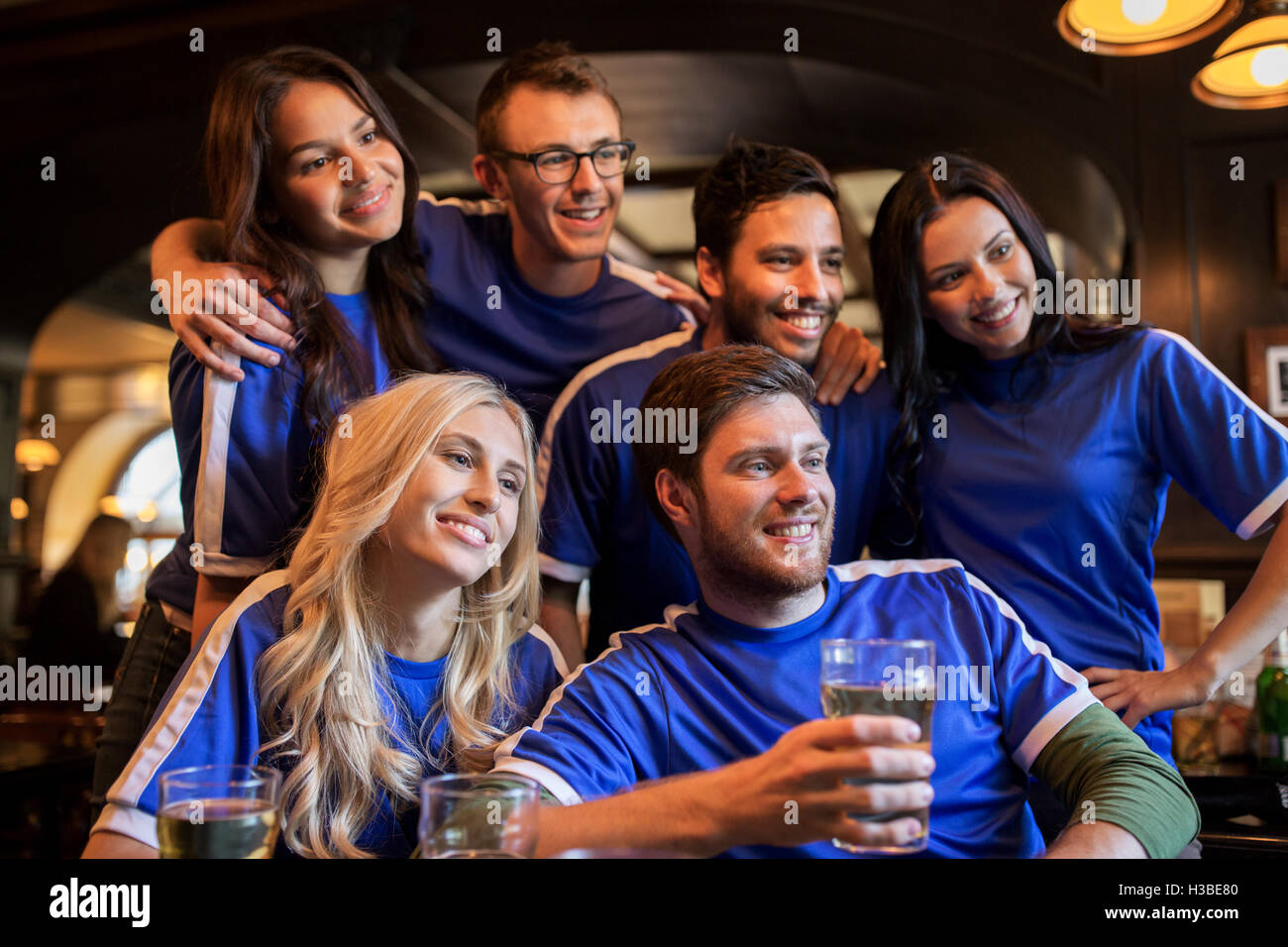 football fans or friends with beer at sport bar Stock Photo - Alamy