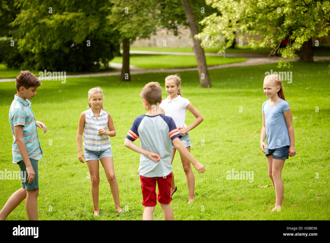 happy kids playing game in summer park Stock Photo - Alamy