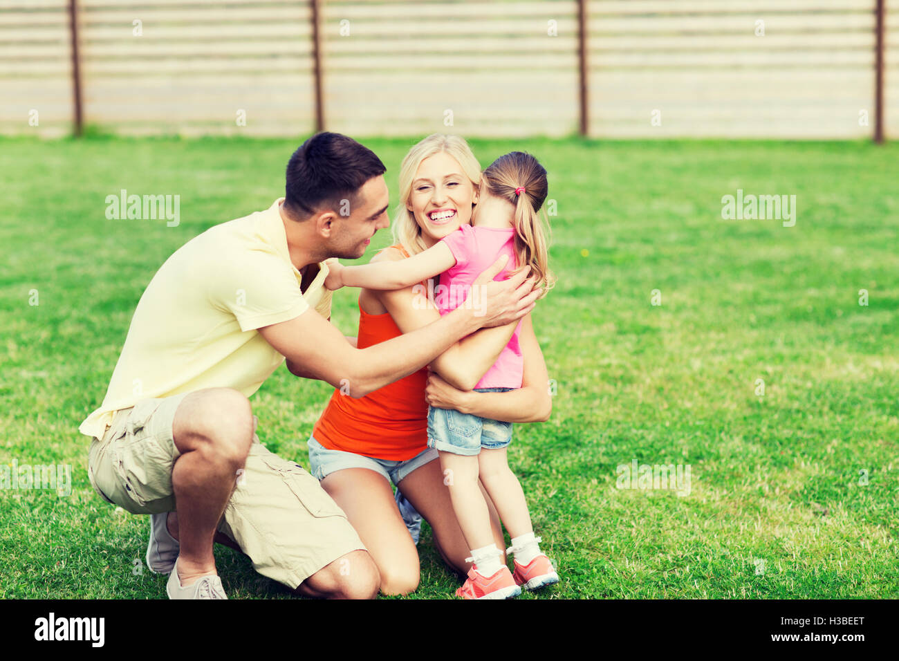 happy family hugging outdoors Stock Photo - Alamy