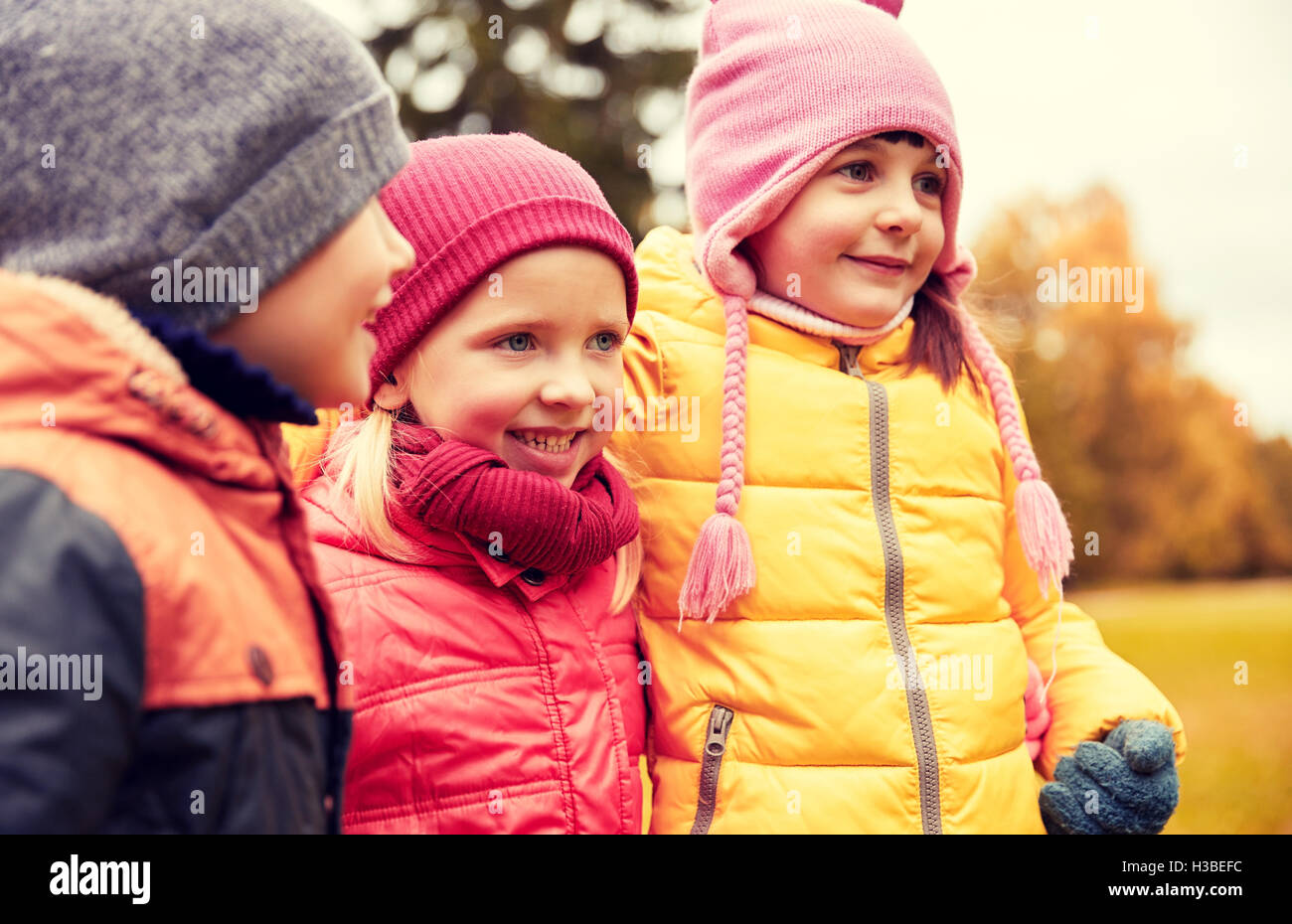 group of happy children hugging in autumn park Stock Photo - Alamy