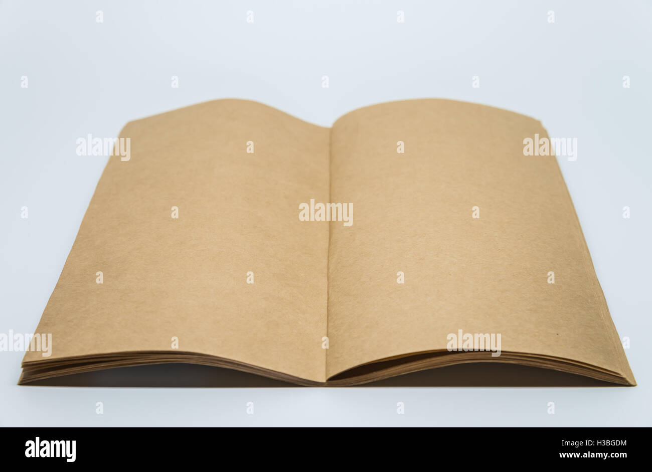 Brown plain notebook with white background and selective focus Stock ...