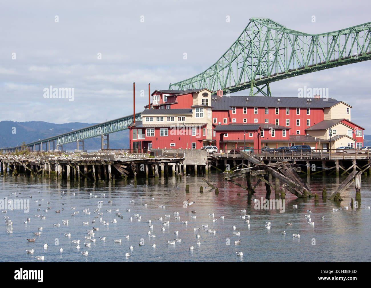 The wooden house standing next to the long bridge over Columbia River ...