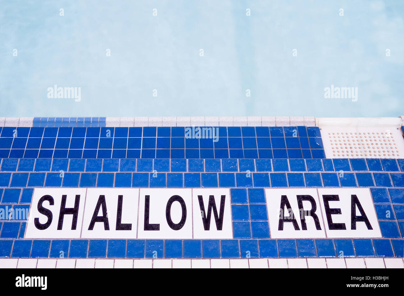 Shallow area of swimming pool, no diving Stock Photo - Alamy