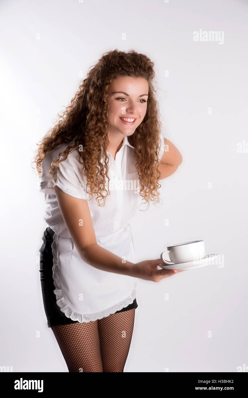 Young attractive waitress in uniform - A long curly haired waitron ...