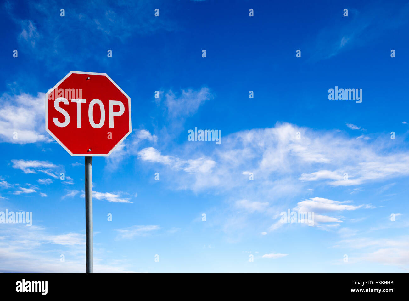 Conceptual stop sign with blue sky background and copy space Stock ...