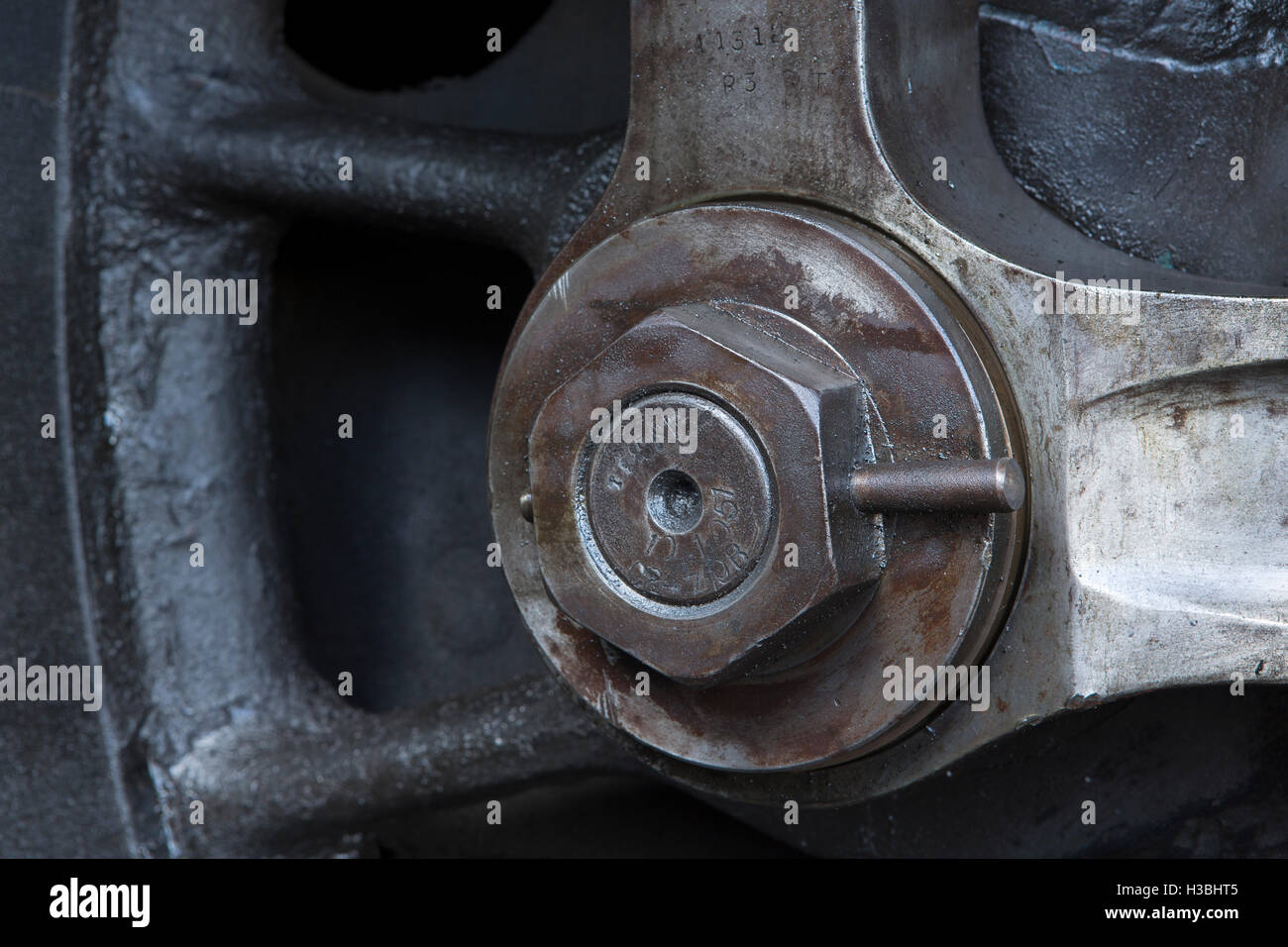 Mechanical parts consisting a large wheel and huge central nut with ...