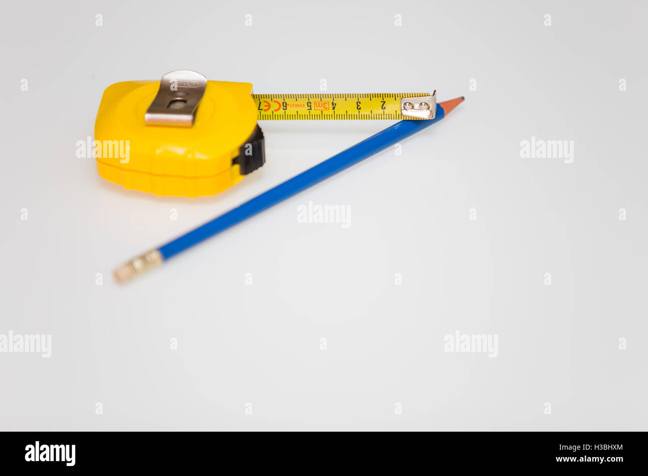 Meter stick and pencil / background Stock Photo - Alamy