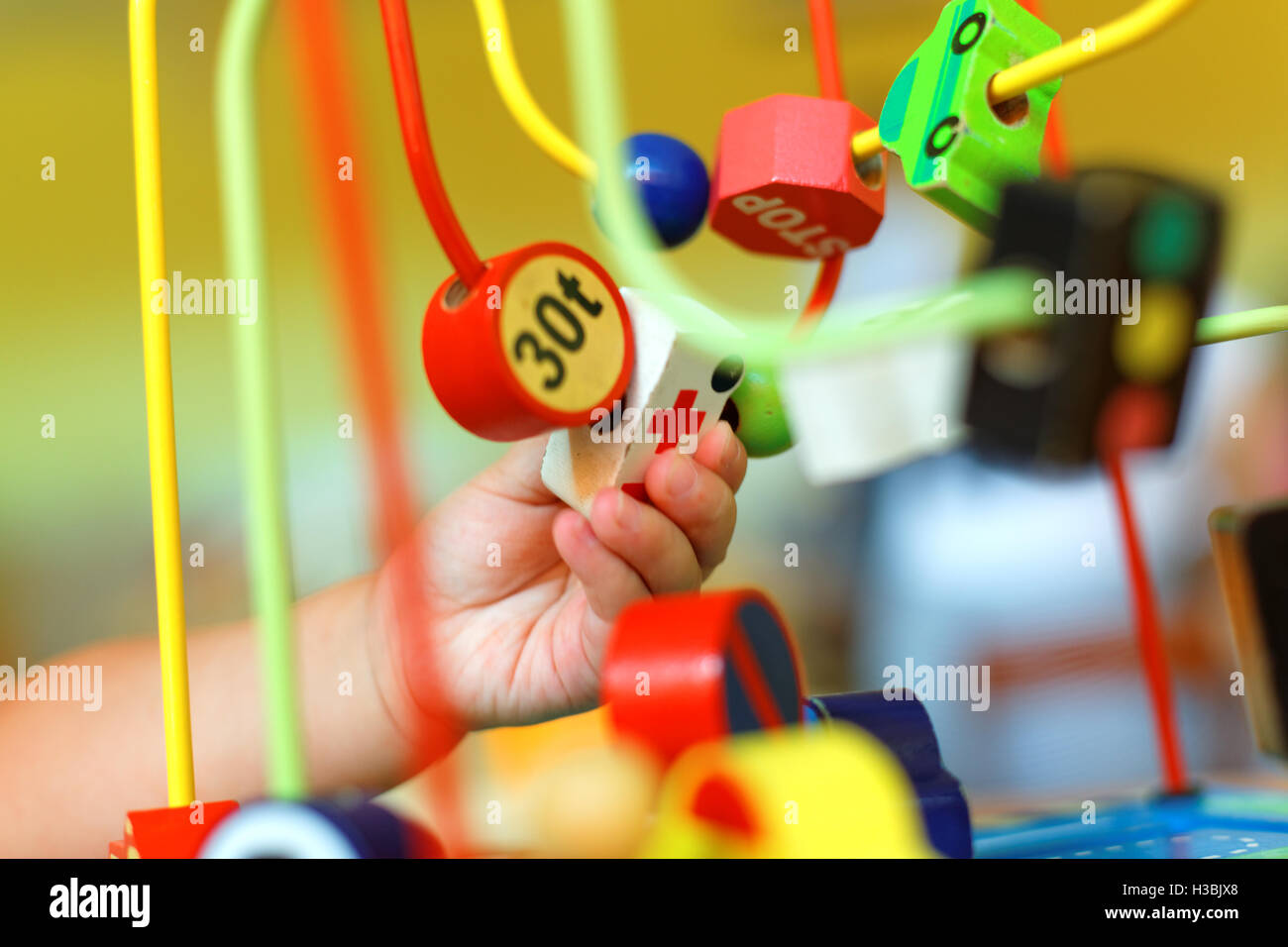 hand of child playing in kids development center Stock Photo - Alamy