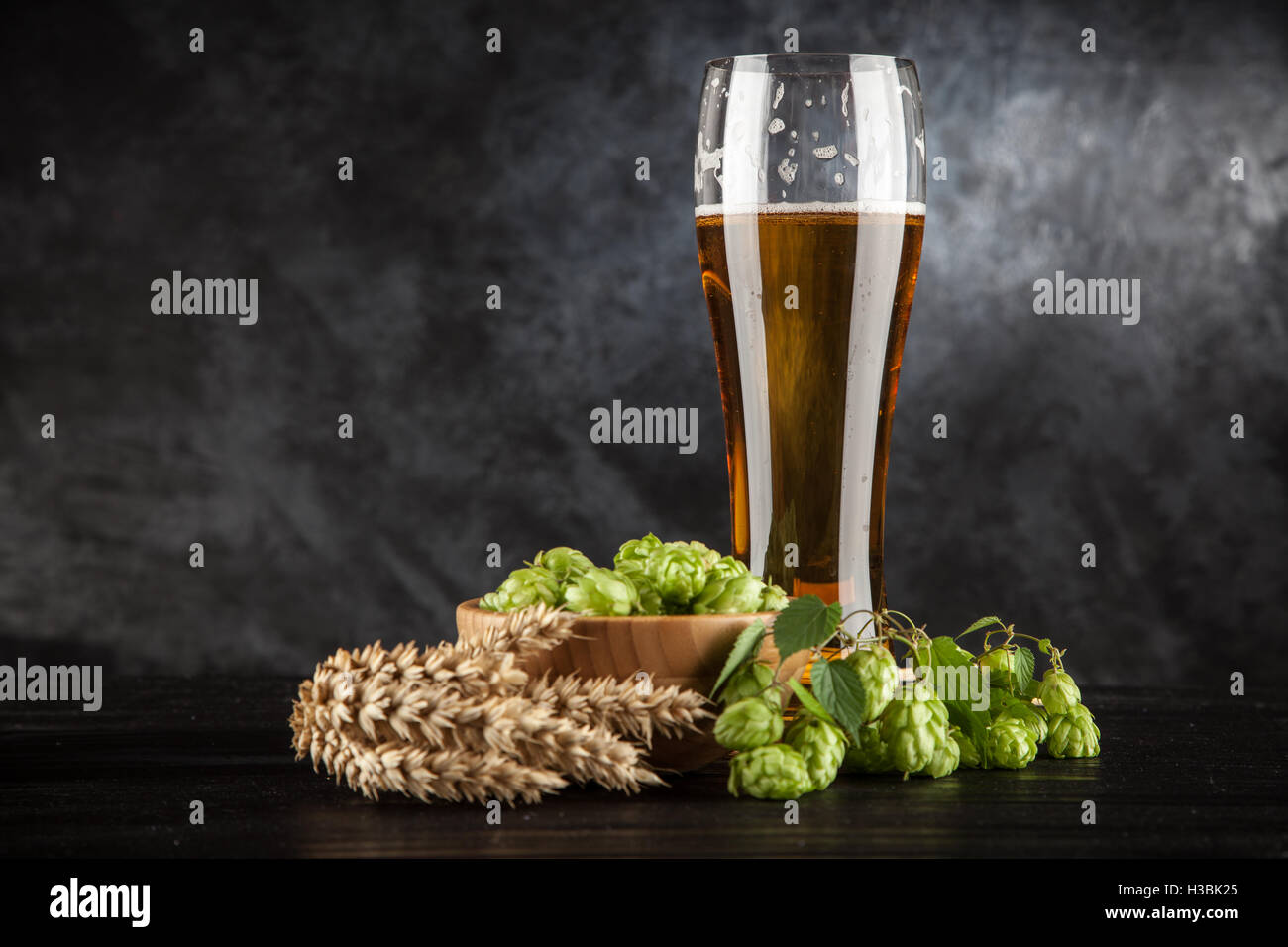 Beer glass on dark background Stock Photo - Alamy