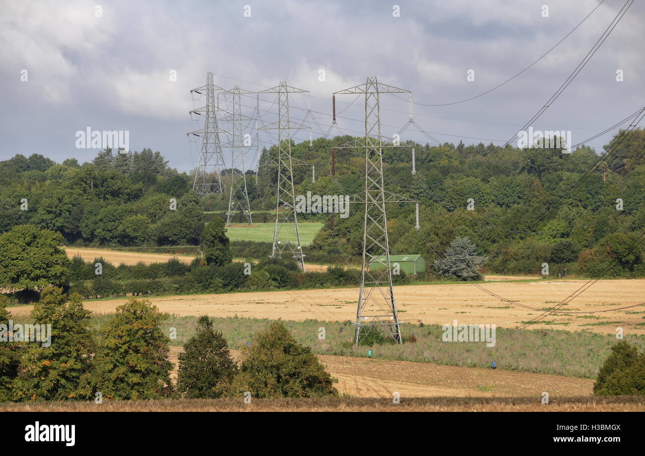 Row of Electricity Pylons in the Chiltern Hills in England Stock Photo ...