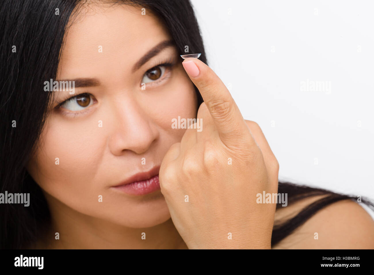 Woman contact lenses hi-res stock photography and images - Alamy