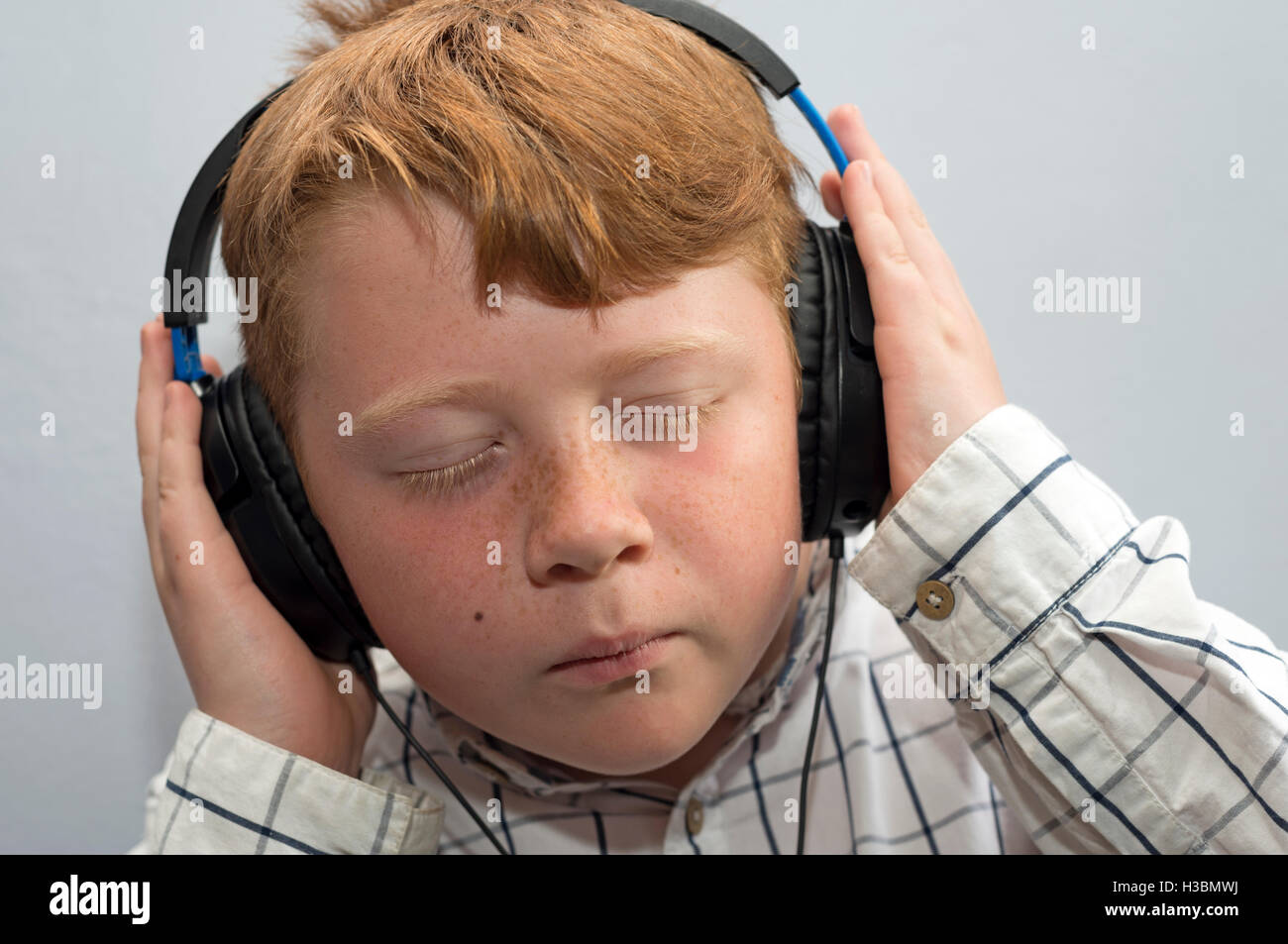 Boy wearing headphones Stock Photo - Alamy