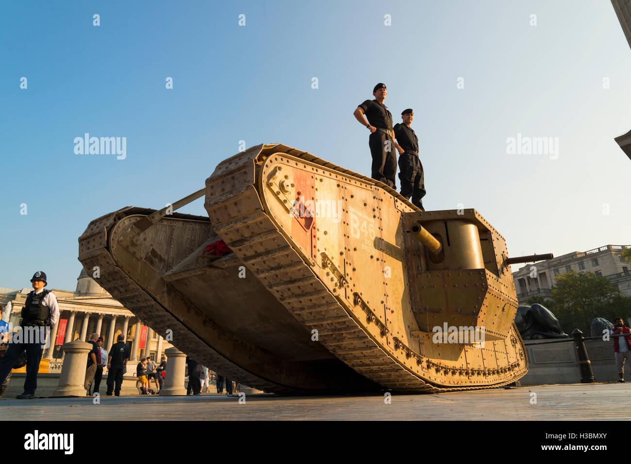 Two soldiers from the Royal Tank Regiment standing on a replica Mk IV ...