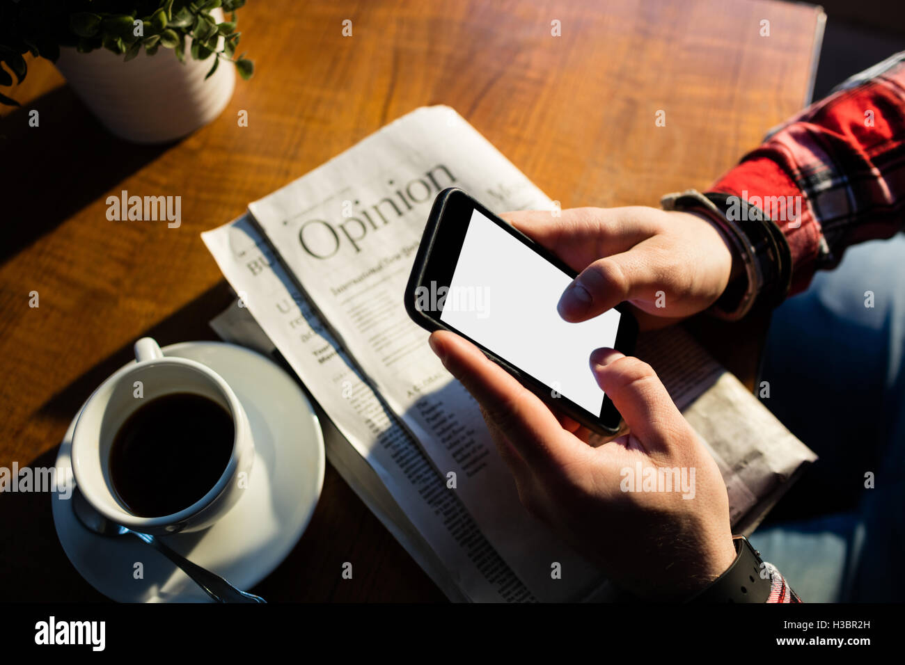 High angle view of customer texting on cellphone Stock Photo - Alamy