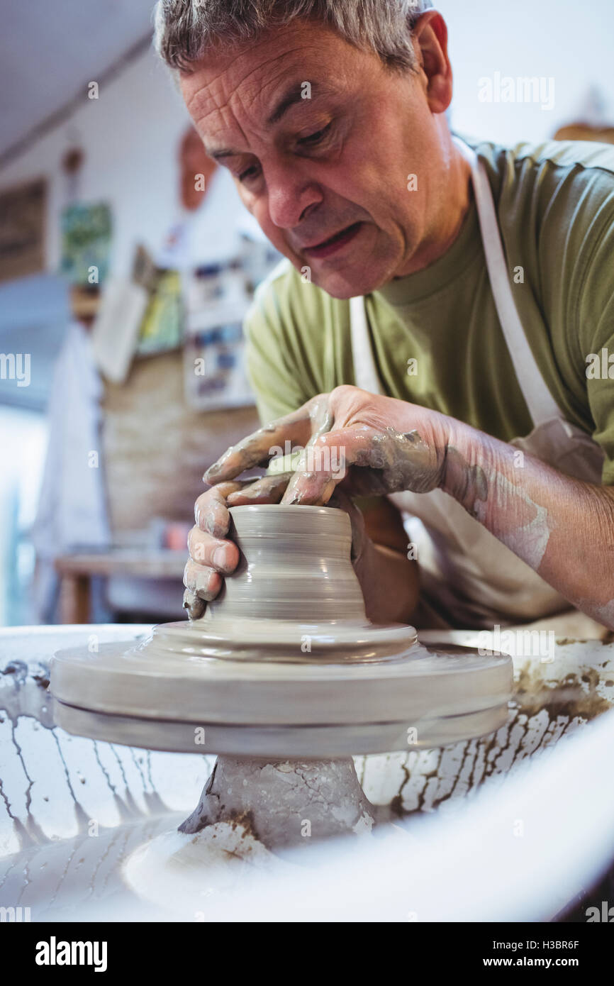Concentrated potter making clay product Stock Photo - Alamy
