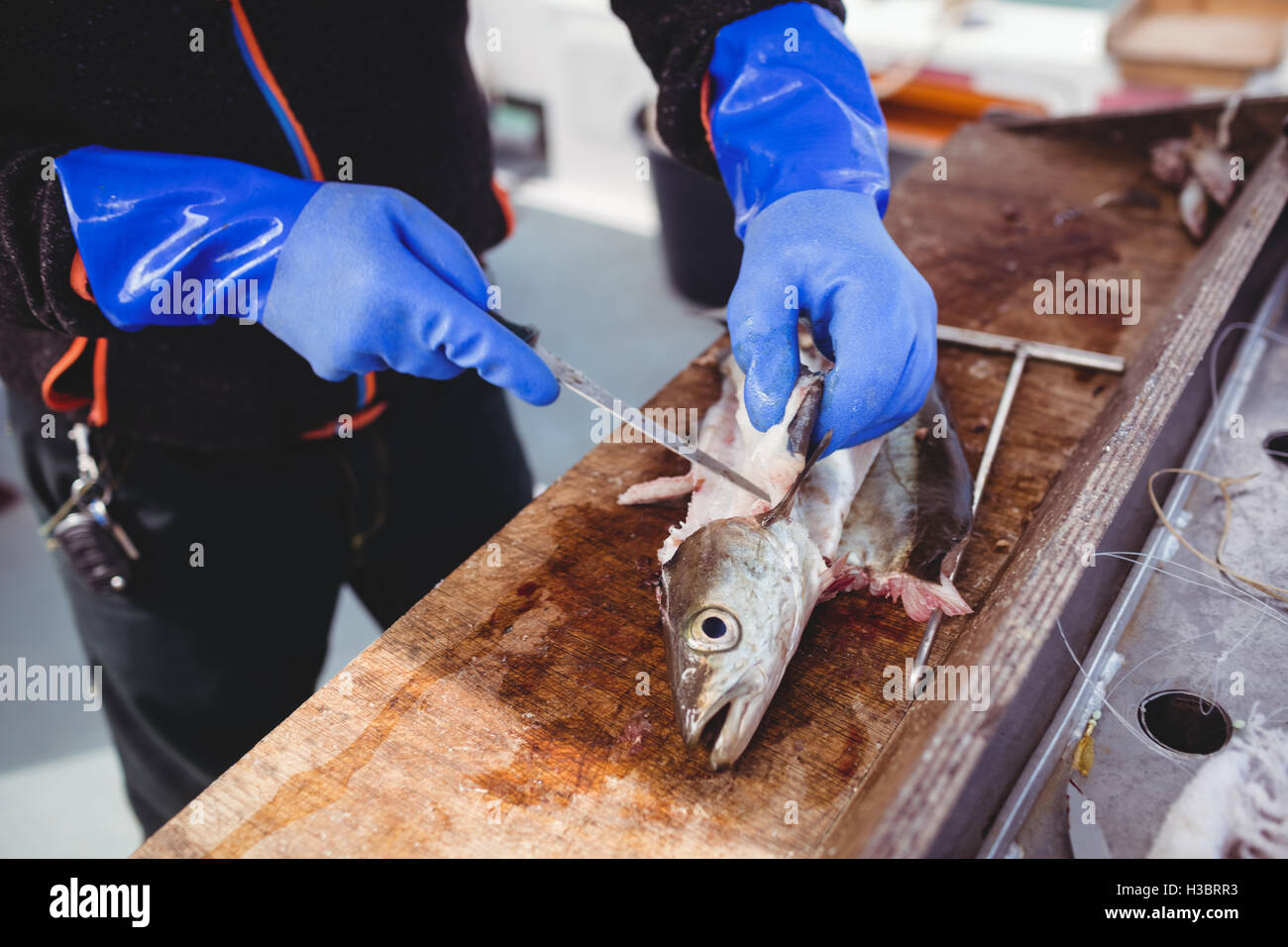 Fisherman filleting fish hi-res stock photography and images - Alamy
