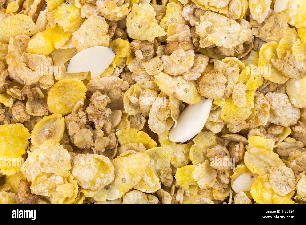 Close up of breakfast cereal with corn flakes, oat clusters, sliced ...