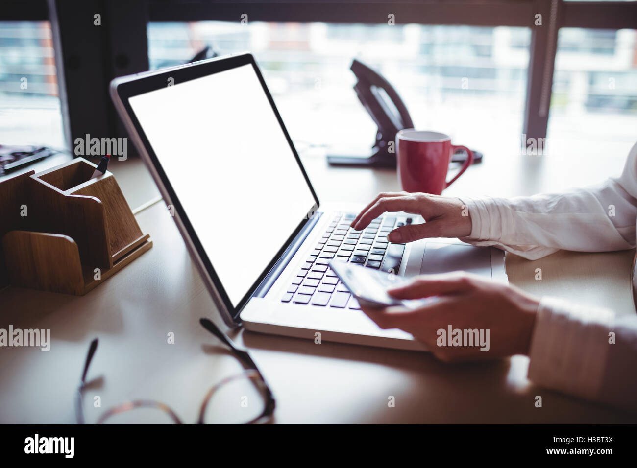 Business woman laptop phone hi-res stock photography and images - Alamy