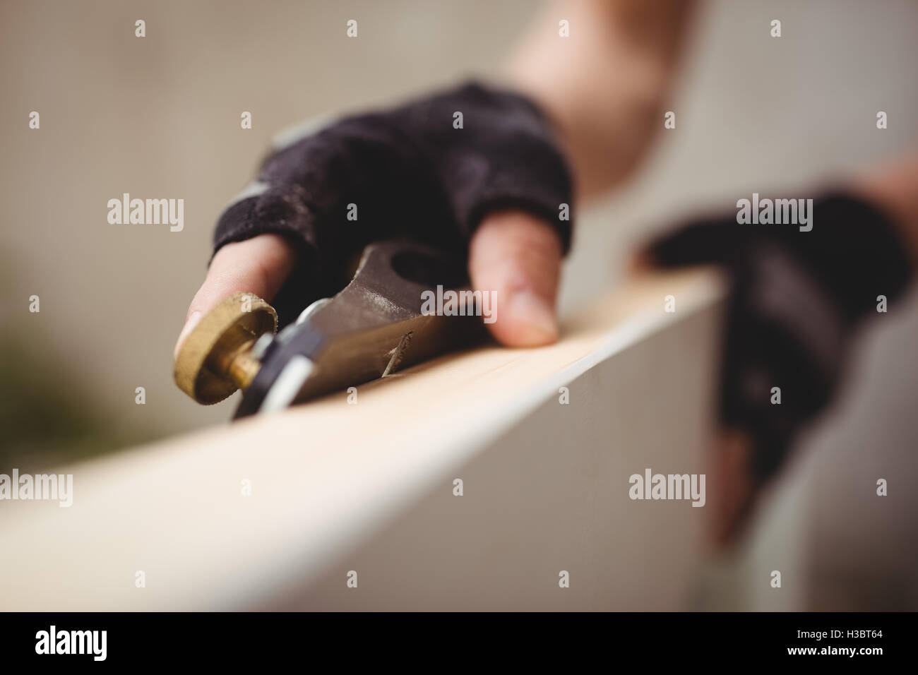 Carpenter's hand leveling a wooden frame with block plane Stock Photo ...