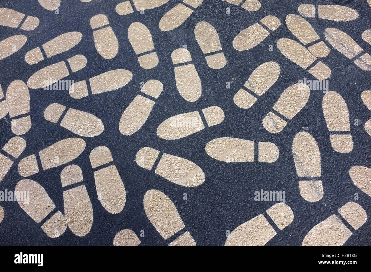 Golden footprints painted onto the pavement in Montreal, Quebec, Canada ...