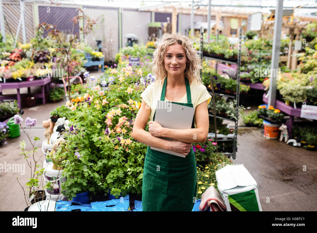 Portrait of female florist standing Stock Photo - Alamy
