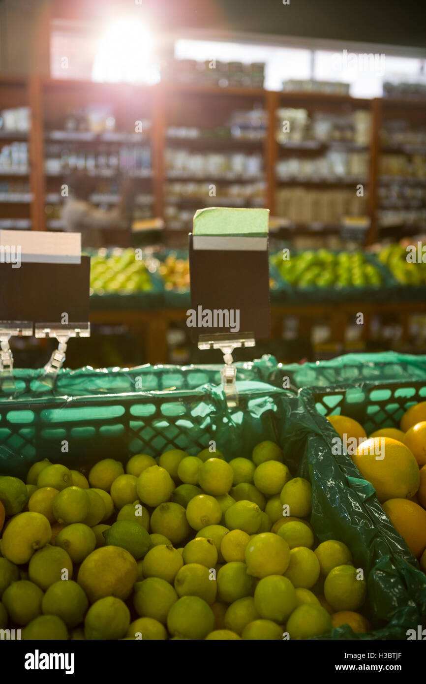Lemons on display shelf Stock Photo - Alamy