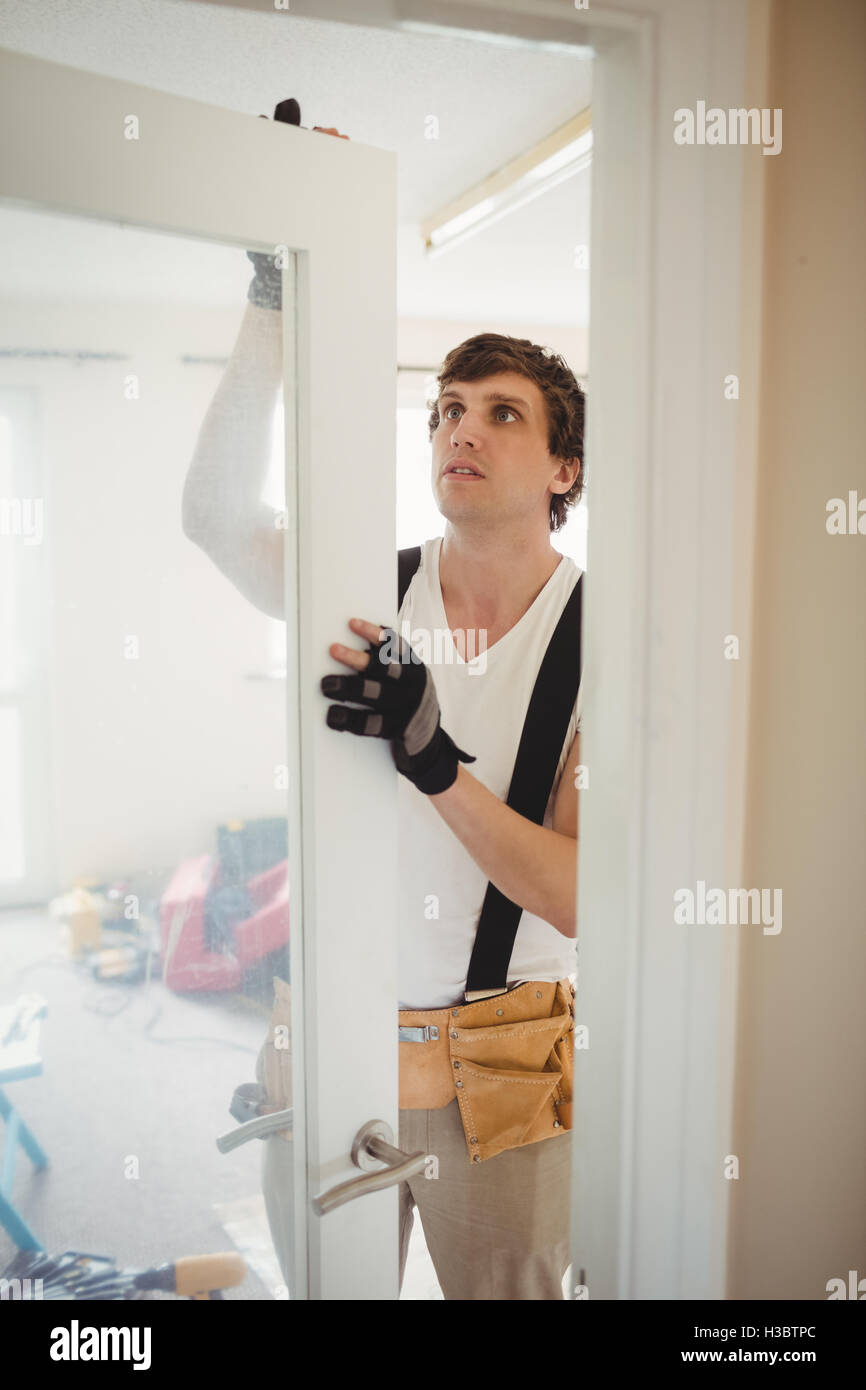 Carpenter fixing a door Stock Photo - Alamy