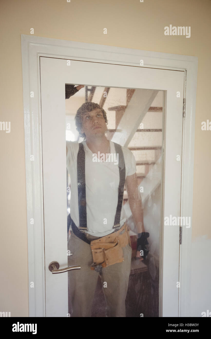 Carpenter Fixing A Door Stock Photo Alamy